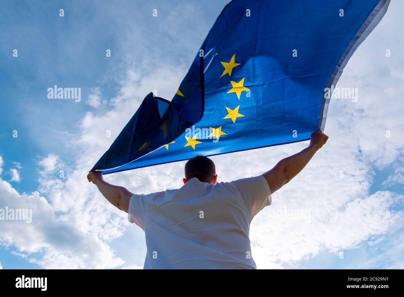 Man holding EU Flag or European Union flag, concept picture Stock Photo ...