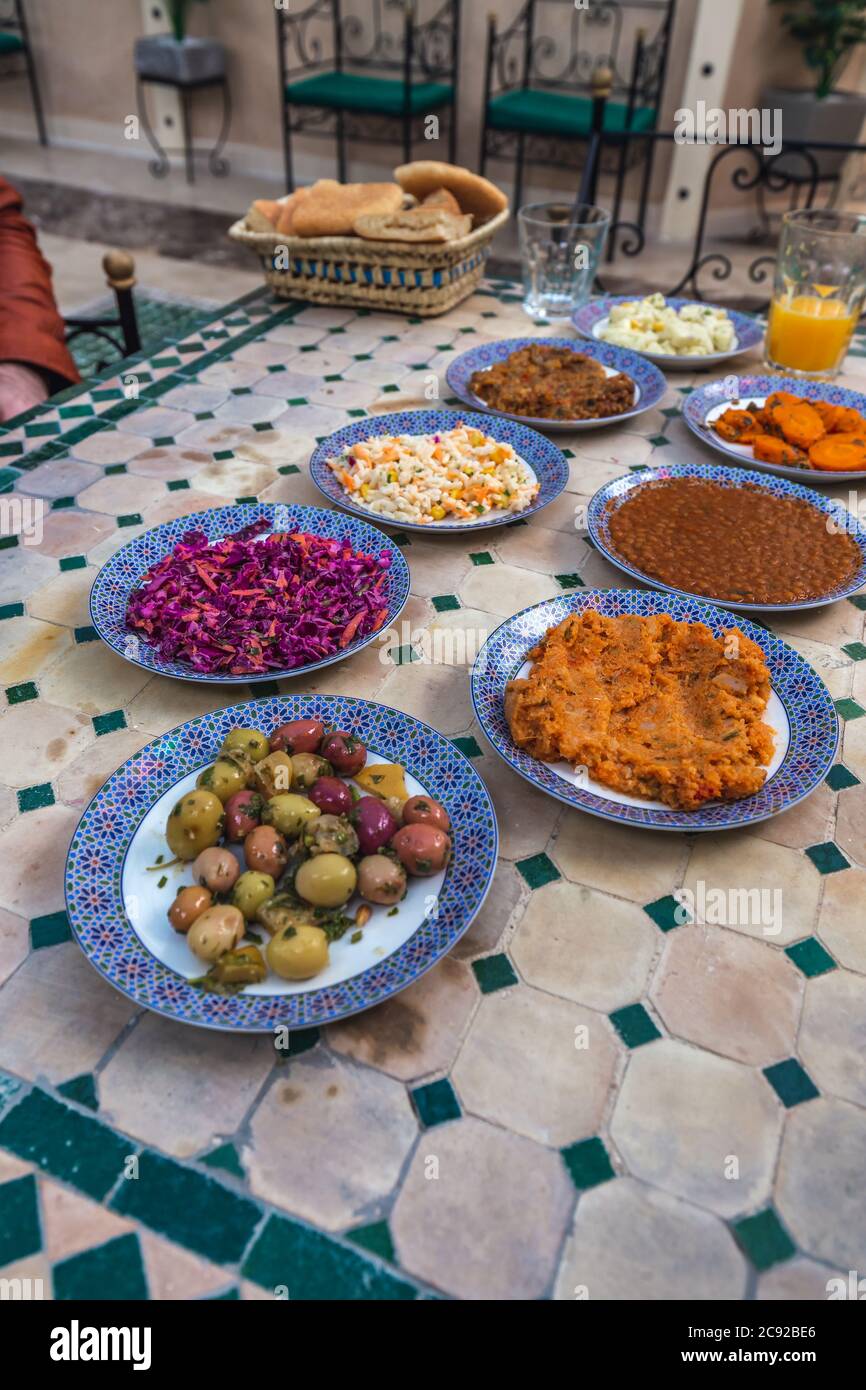 A selection of Moroccan mezze or appetisers including carrots, potatoes ...