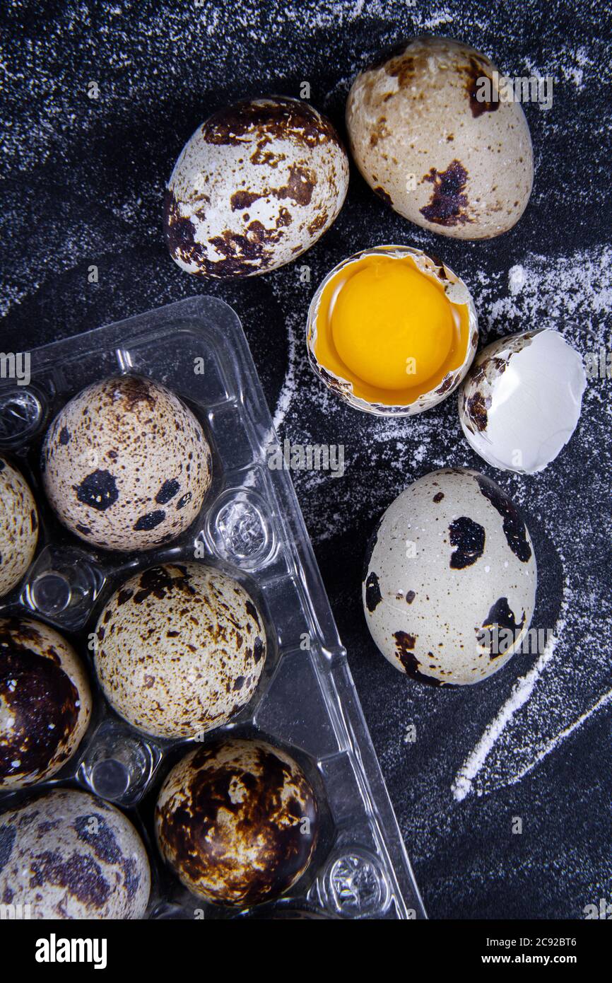 The quail egg is next to the native eggs and an egg yolk outside or ...