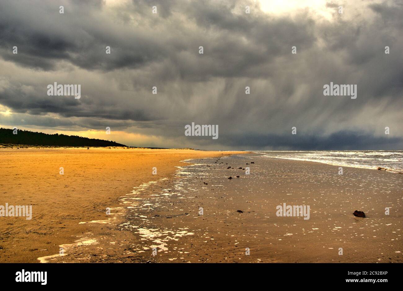 Dark storm cloud over a beach Stock Photo - Alamy