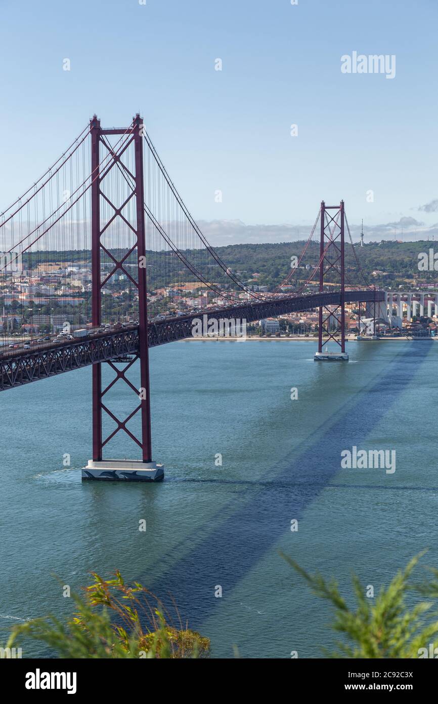 Bridge on April 25 in Lisbon on the Tejo river with moving cars. A ...