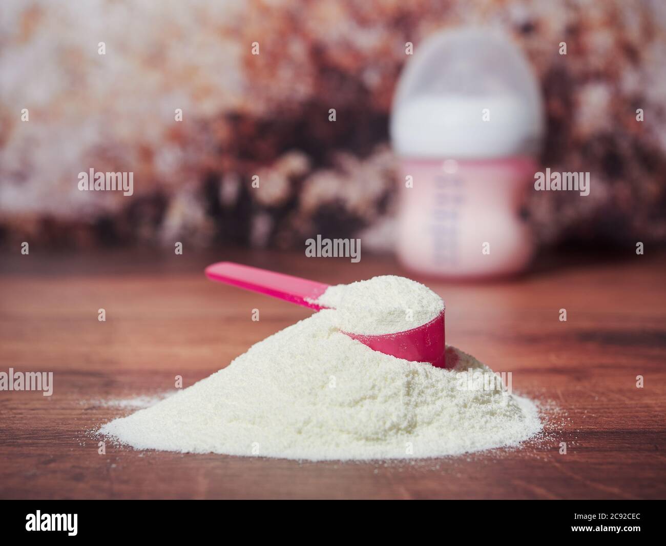 A heap of organic milk formula for infants, with measuring spoon, on ...