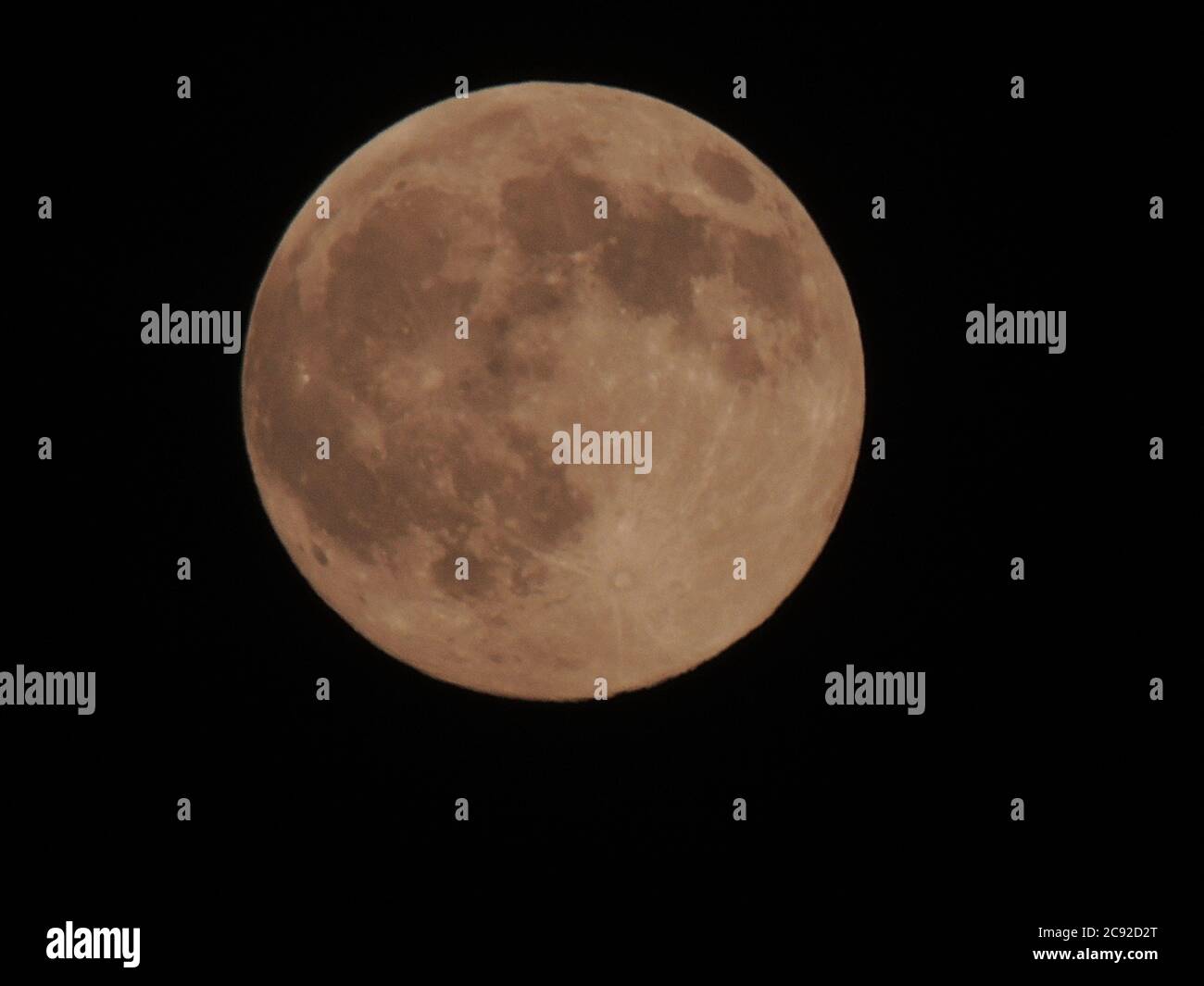 Full brown moon in the black sky at night Stock Photo - Alamy