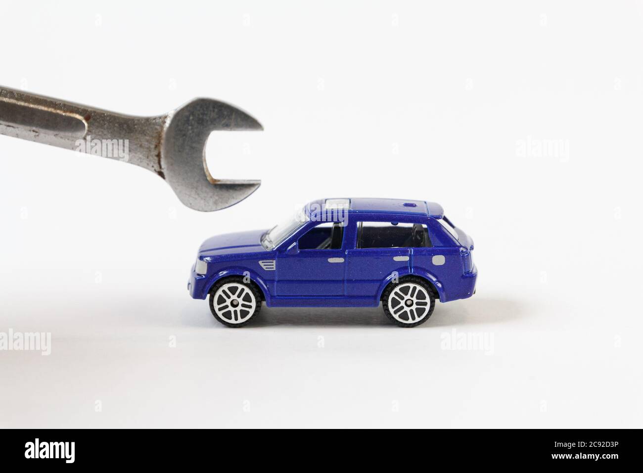 Concept of car repairing and maintenance. The toy car repair with ...