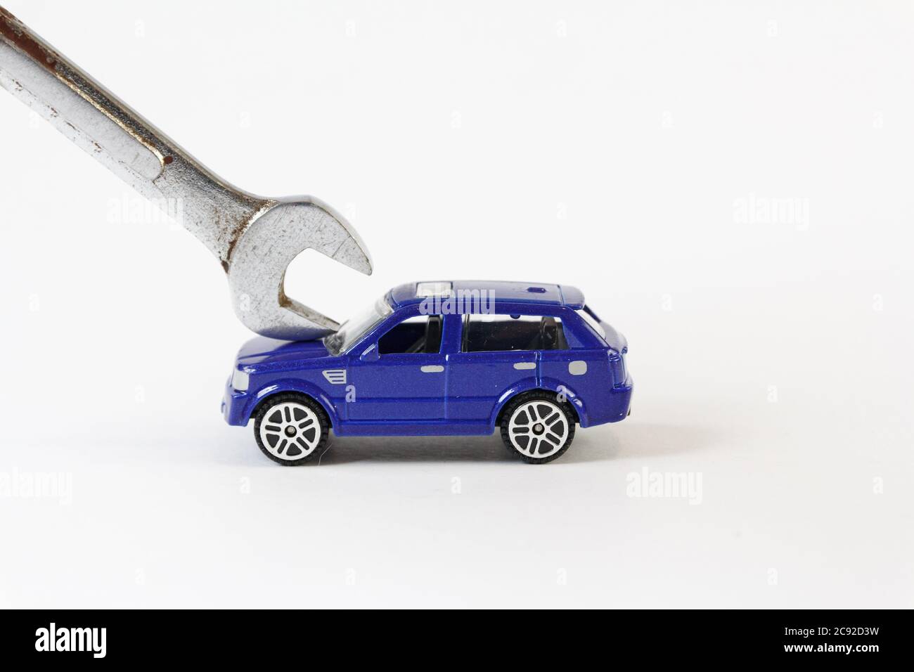 Concept of car repairing and maintenance. The toy car repair with ...