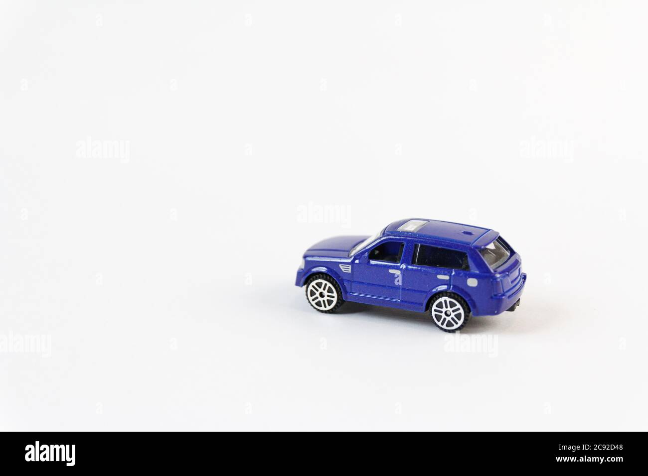 a little toy blue car with white background Stock Photo - Alamy