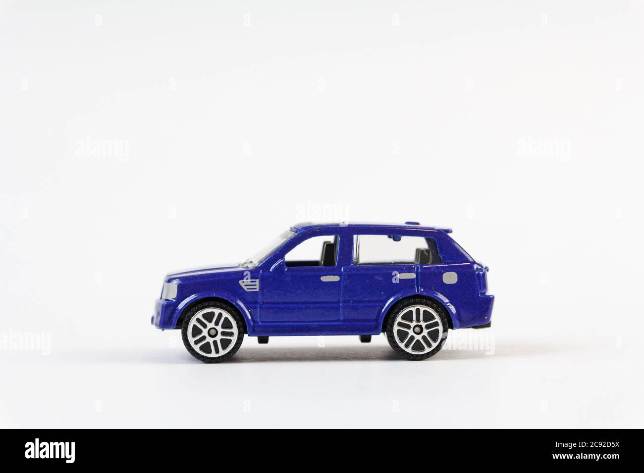 a little toy blue car with white background Stock Photo - Alamy