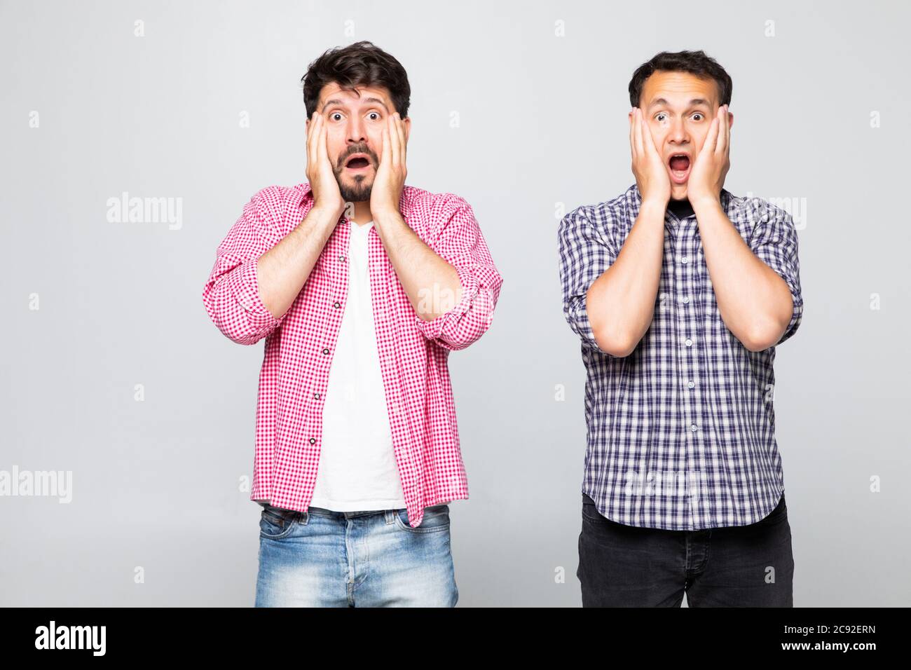 Shocked two men look with amazement at camera, cant believe in failure ...