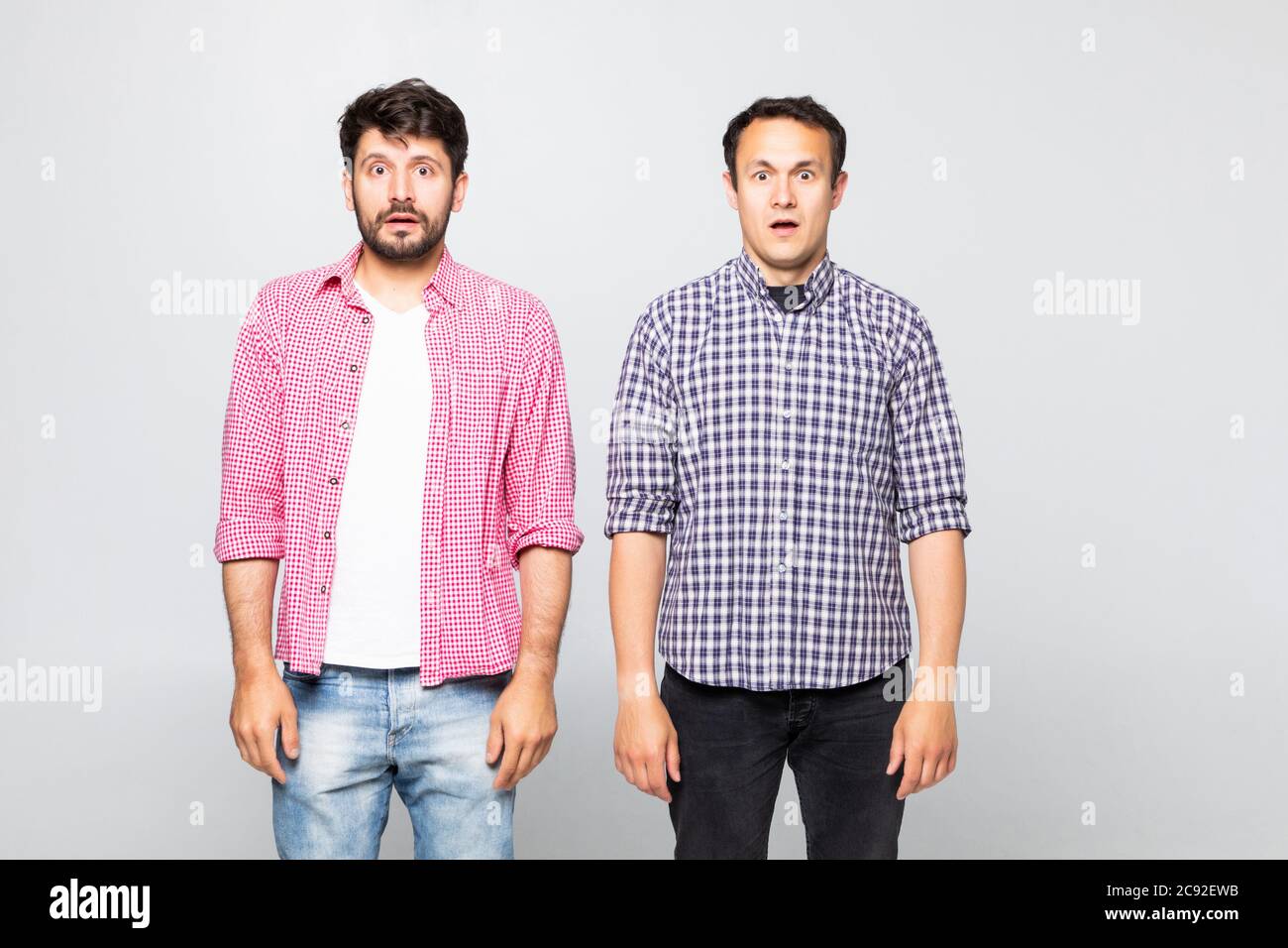 Shocked two men look with amazement at camera, cant believe in failure ...