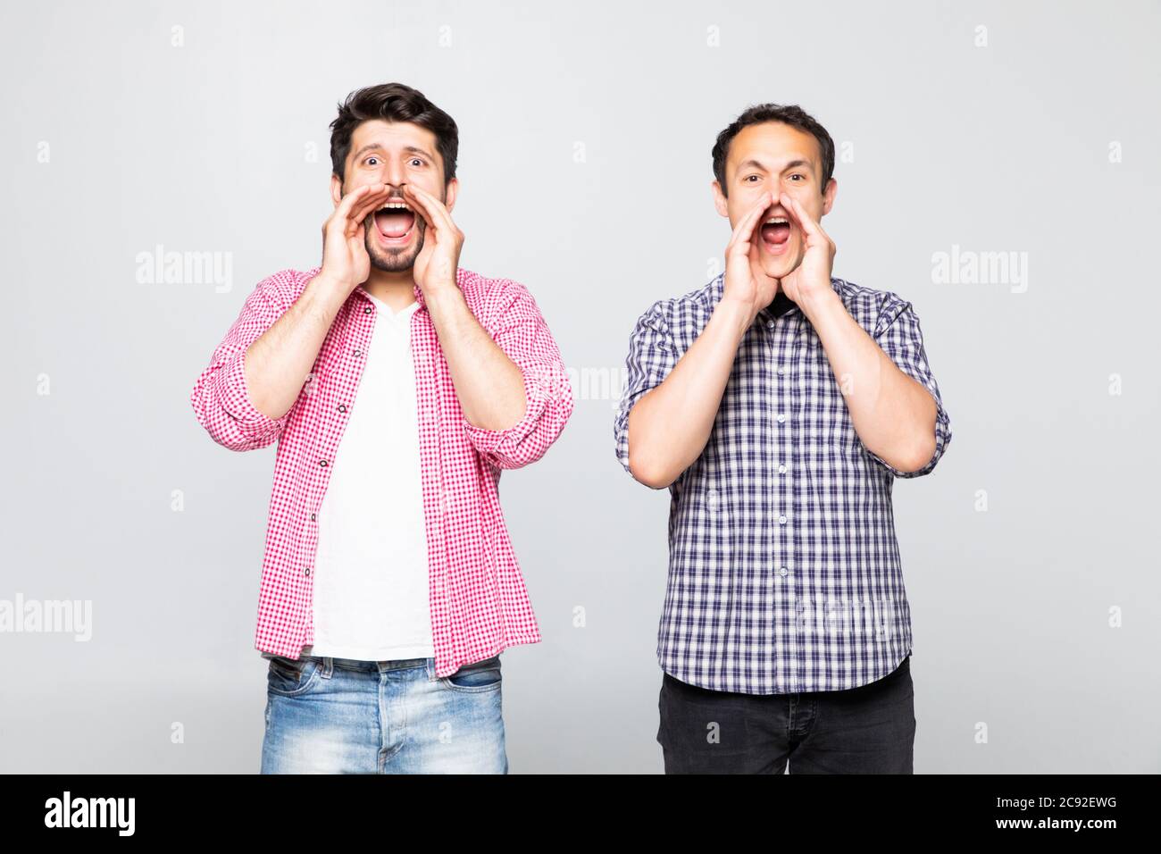 Shocked two men look with amazement at camera, cant believe in failure ...