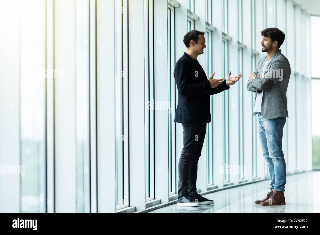 Business partners talking inside the building under construction Stock ...