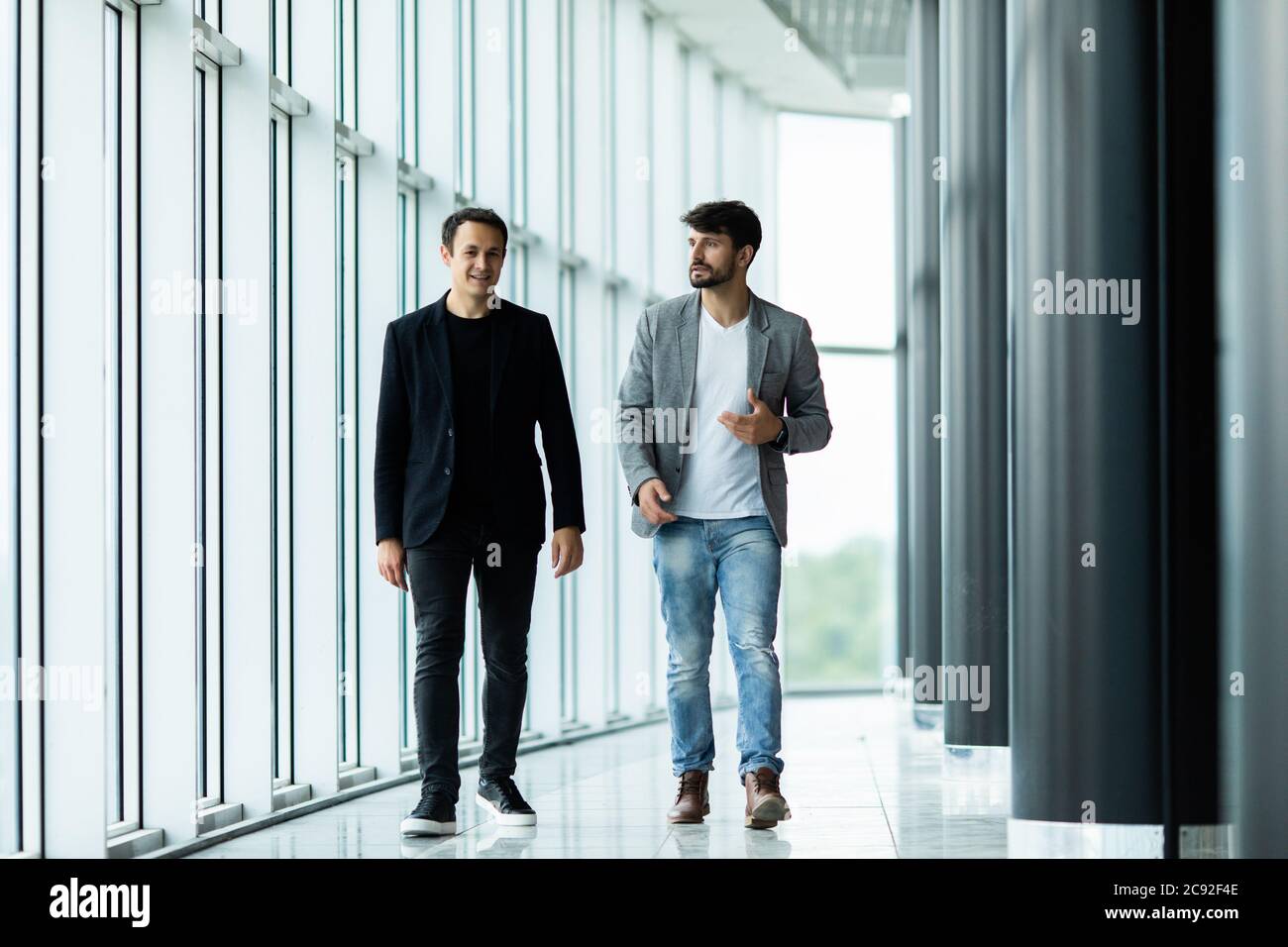 Business partners walking down hi-res stock photography and images - Alamy