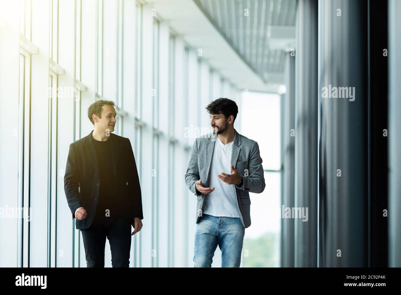Business partners walking down hi-res stock photography and images - Alamy