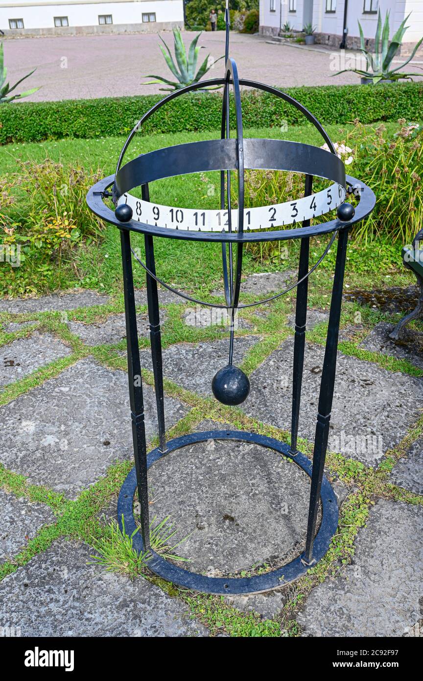 old sundial in a big Swedish garden Stock Photo - Alamy