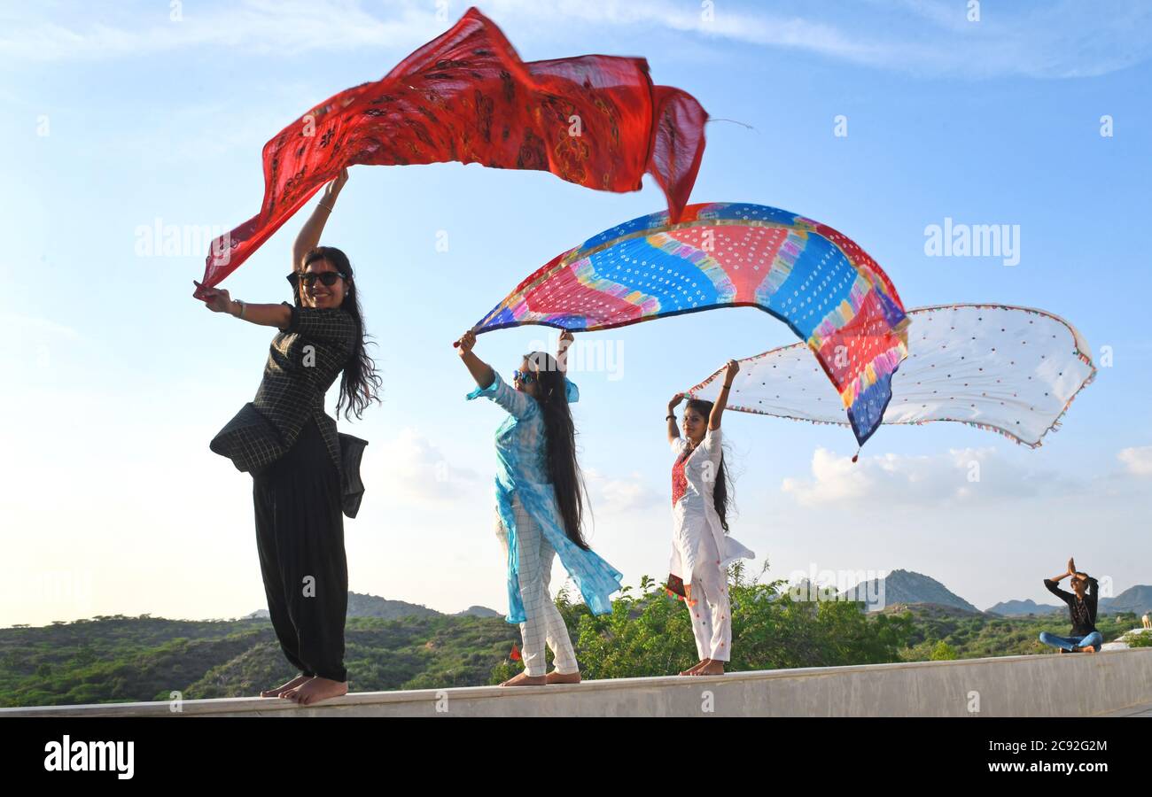 Beawar, Rajasthan, India, July 27, 2020: Young girls wave their scarves ...