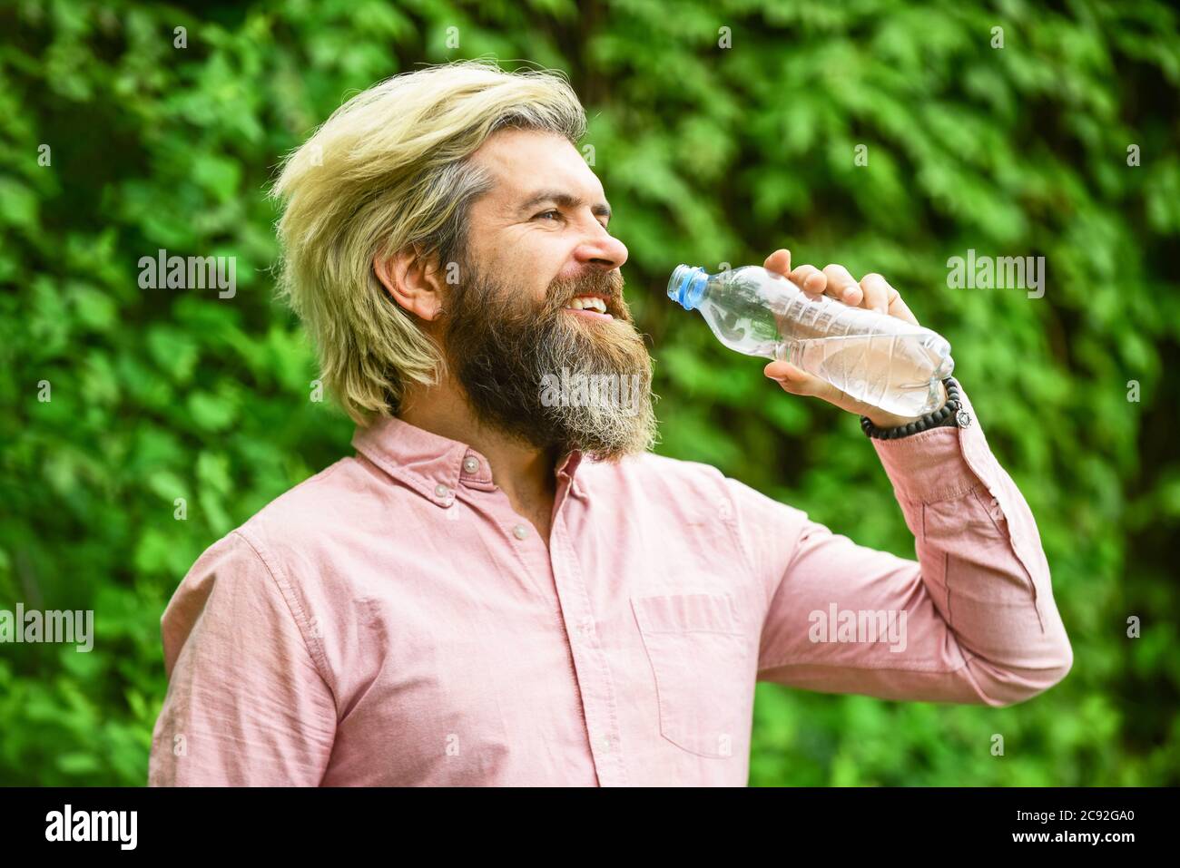 Refreshing lemonade. Soda water. Water balance. Man bearded tourist ...