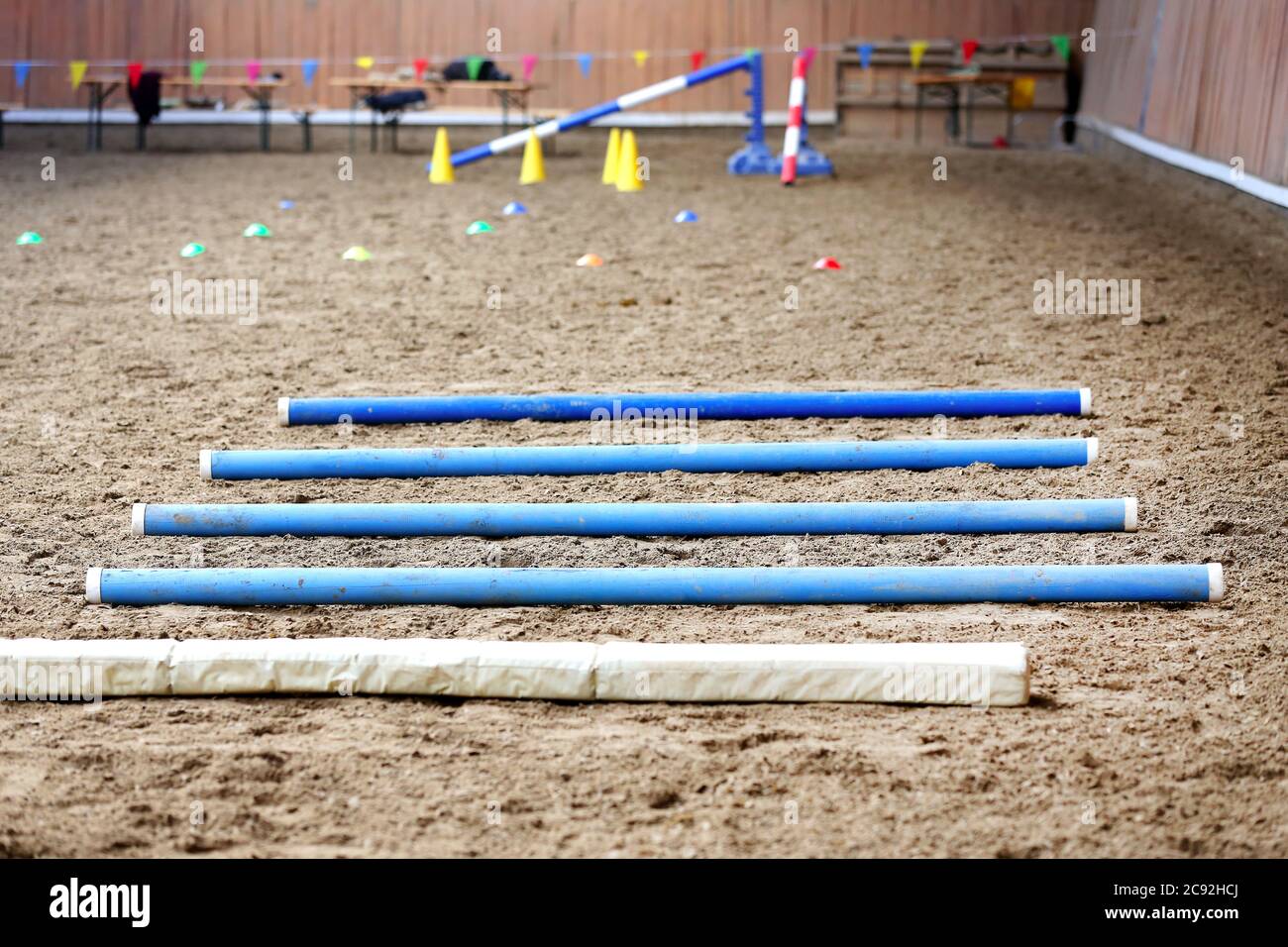 Image of poles on empty training field. Wooden barriers for horses as a ...