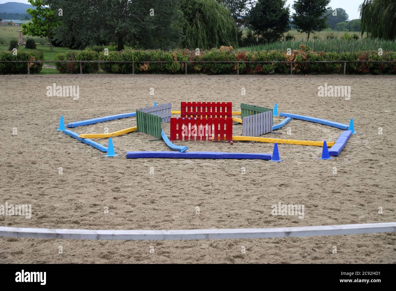 Image of poles on empty training field. Wooden barriers for horses as a ...