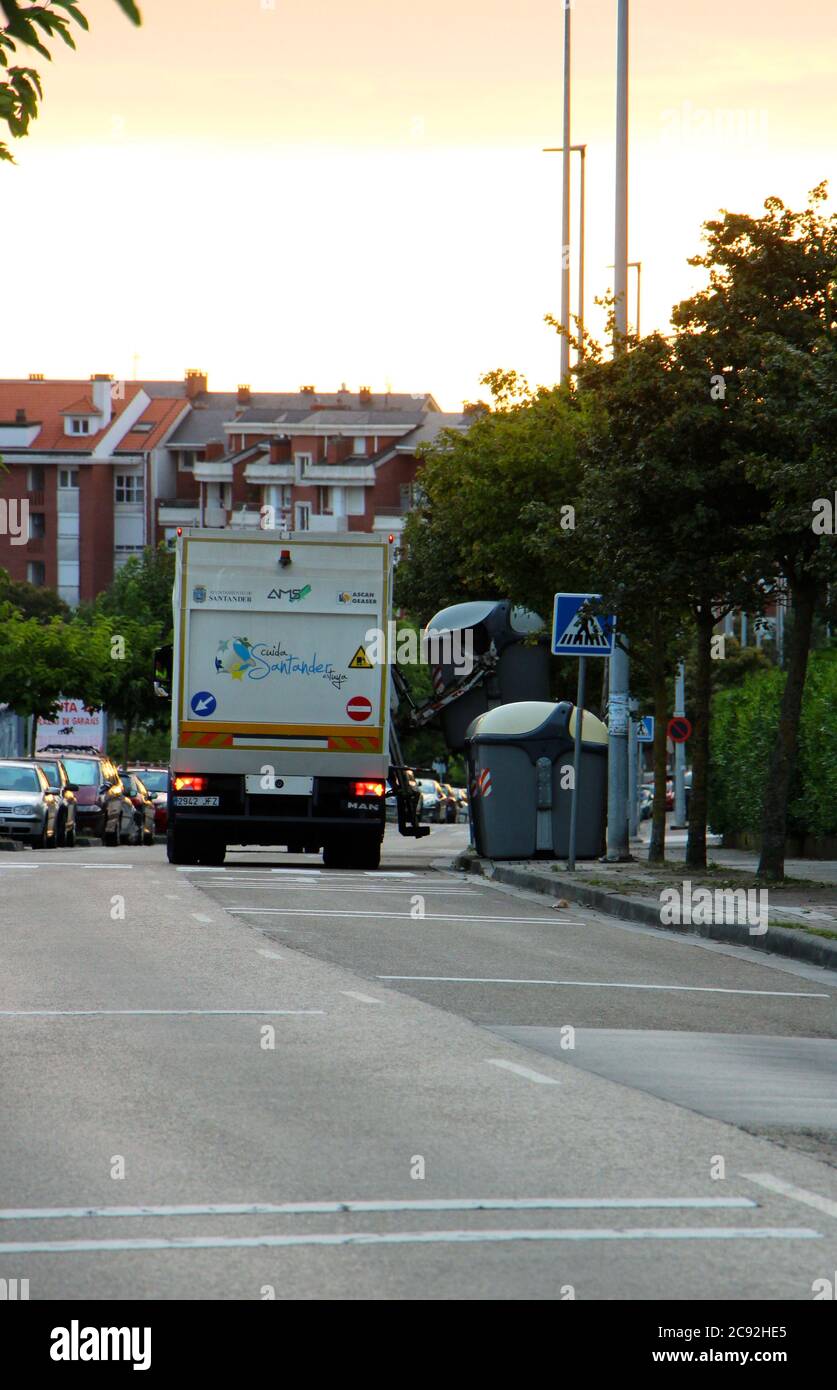 Early morning automated rubbish collection from street roadside plastic ...