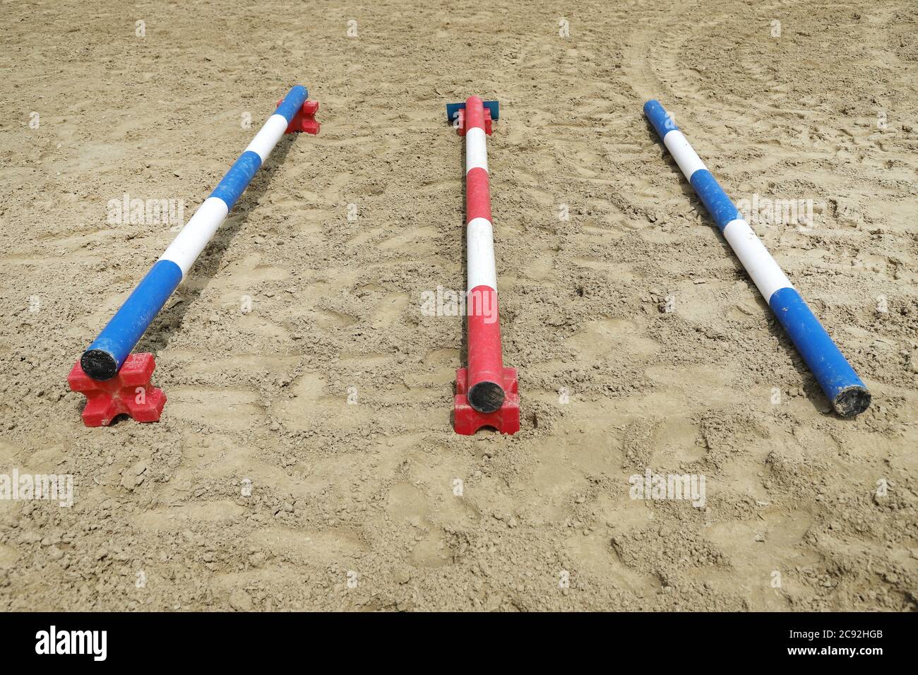 Image of poles on empty training field. Wooden barriers for horses as a ...