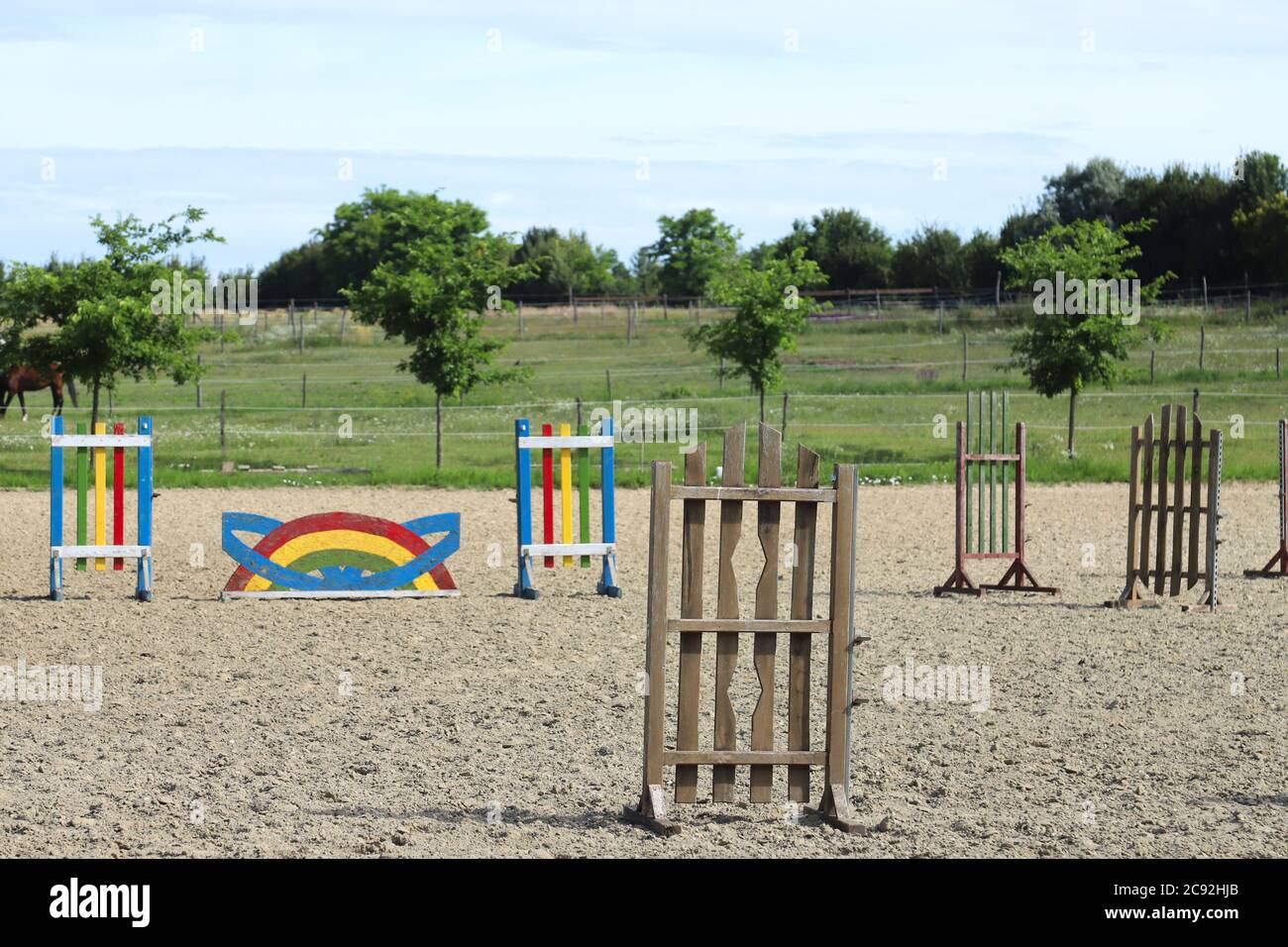 Image of poles on empty training field. Wooden barriers for horses as a ...