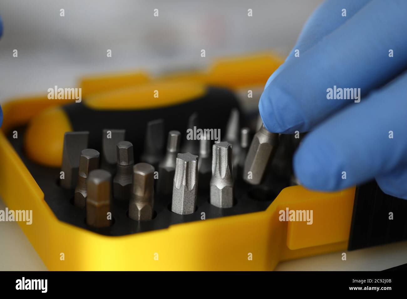 Hand holds screwdriver hi-res stock photography and images - Alamy