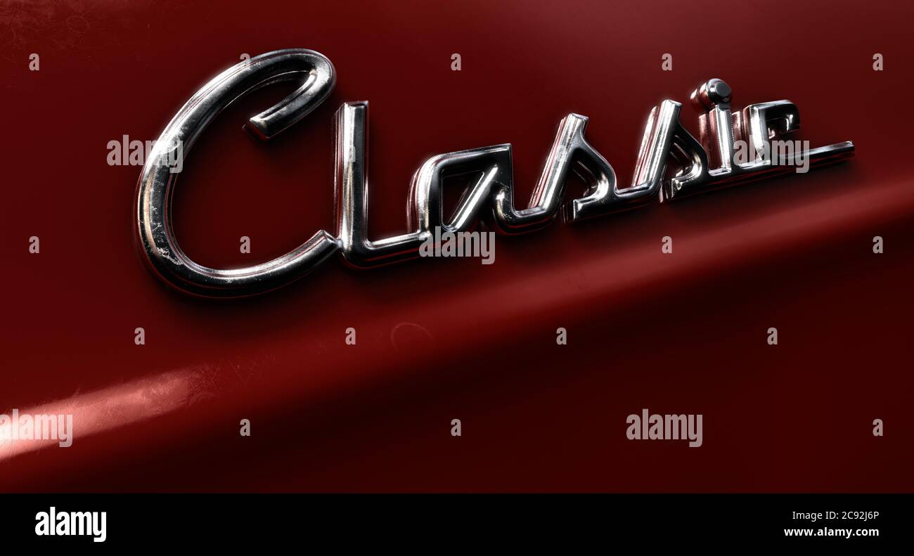 A closeup view of the word classic written as a chrome emblem in a ...