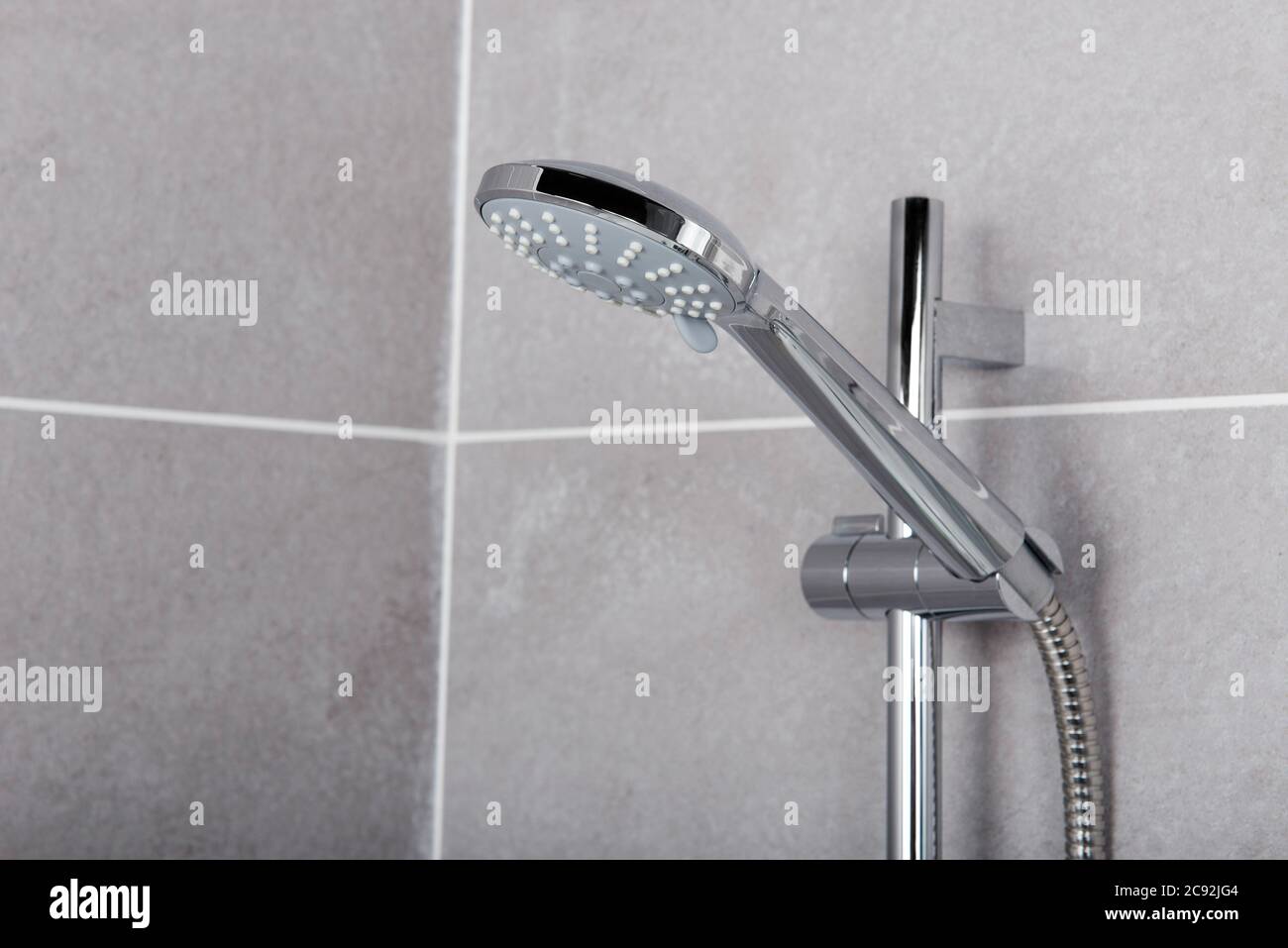 Modern style steel circular shower head in the bathroom Stock Photo - Alamy