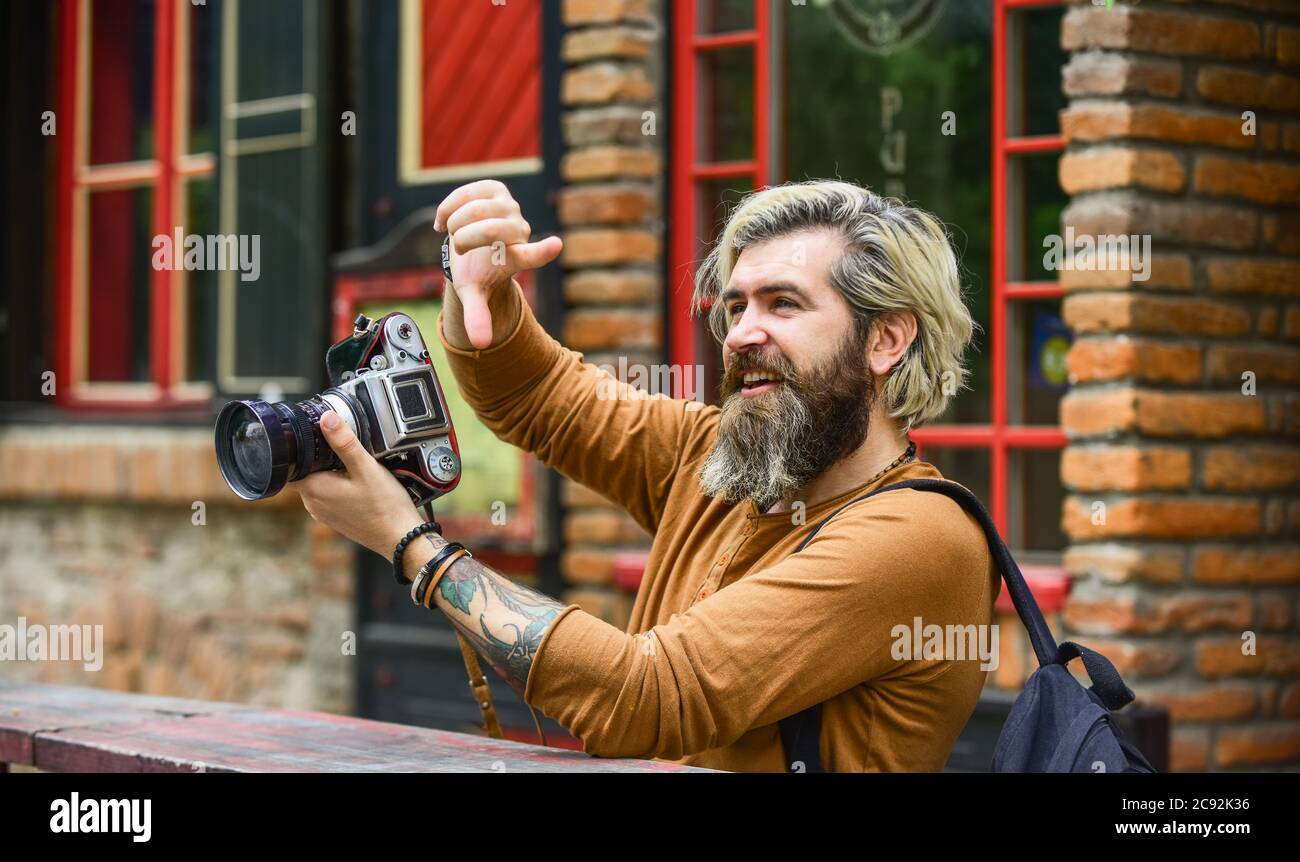 professional look. capture these memories. SLR camera. hipster man with ...