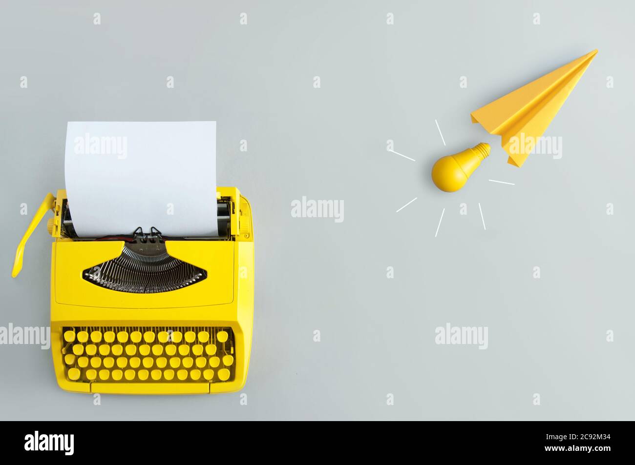 Retro typewriter with yellow paper airplane, and light bulb inspiration ...
