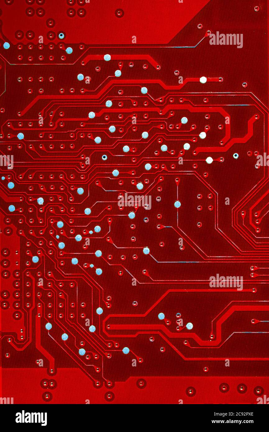 Detail of an electronic printed circuit board a red color Stock Photo ...