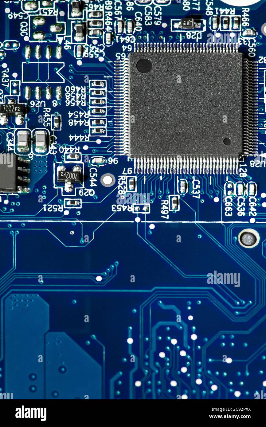 Electronic blue circuit board with processor, cpu on contact legs close ...