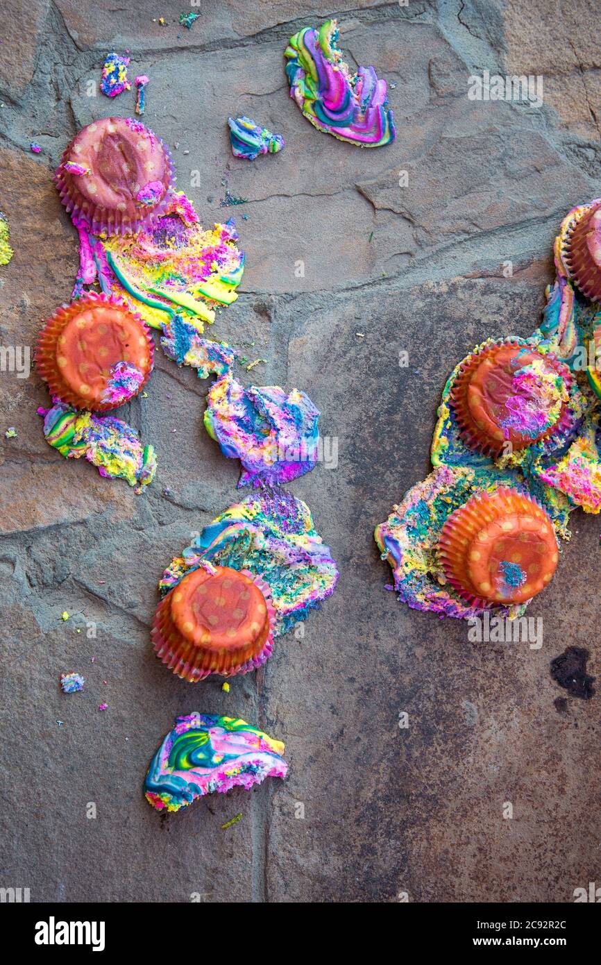 Fresh sweet multi-colored cakes have fallen to a floor, crash of ...