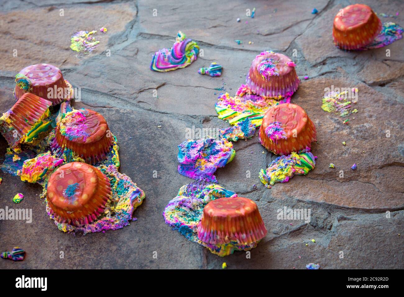 Fresh sweet multi-colored cakes have fallen to a floor, crash of ...