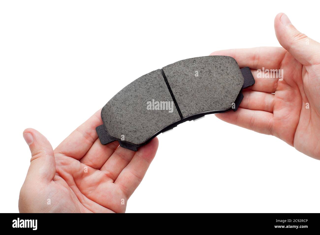Brake pads in the engineer's hand, isolated Stock Photo - Alamy