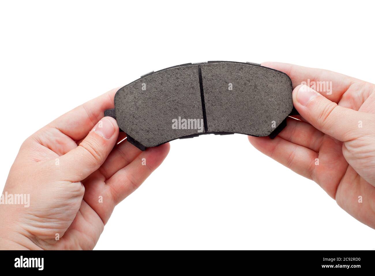Brake pads in the engineer's hand, isolated Stock Photo - Alamy