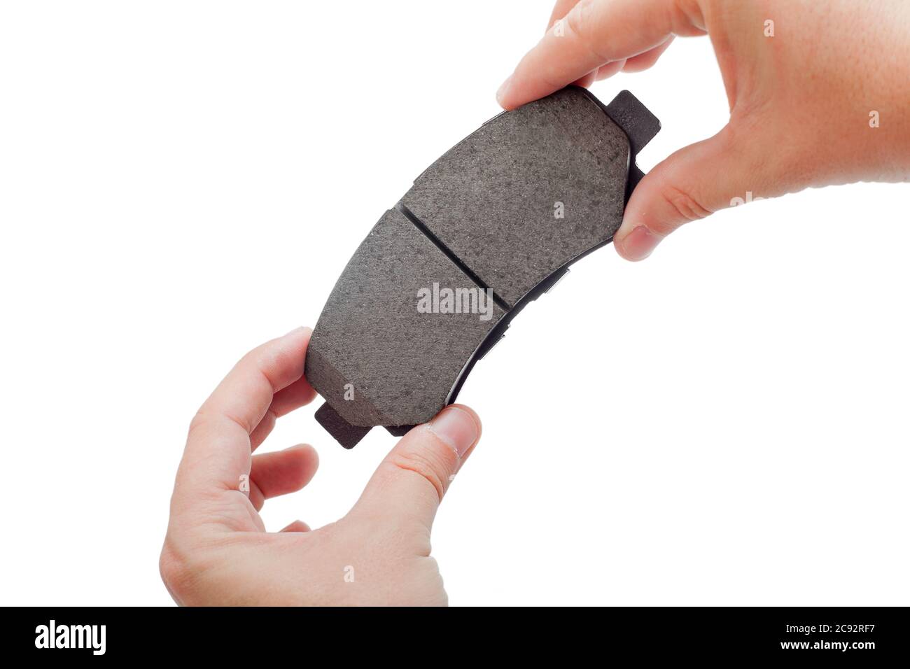 Brake pads in the engineer's hand, isolated Stock Photo - Alamy