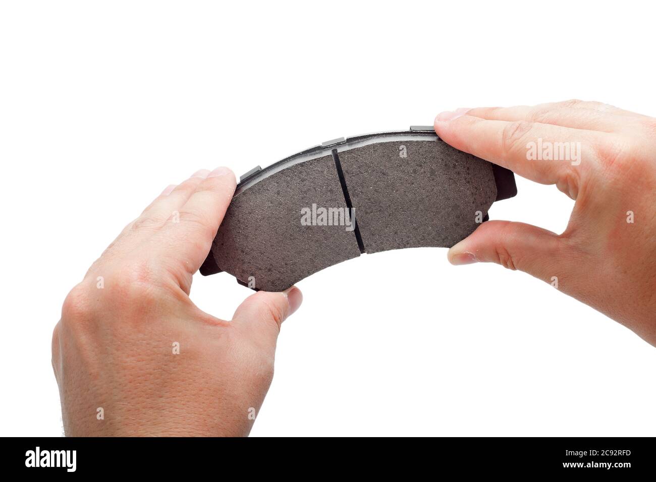 Brake pads in the engineer's hand, isolated Stock Photo - Alamy
