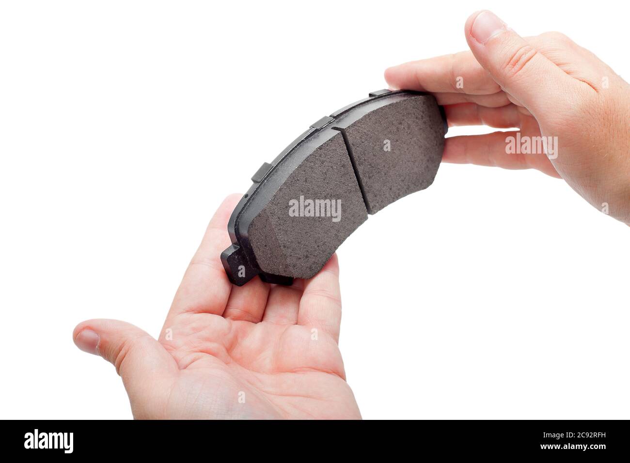 Brake pads in the engineer's hand, isolated Stock Photo - Alamy