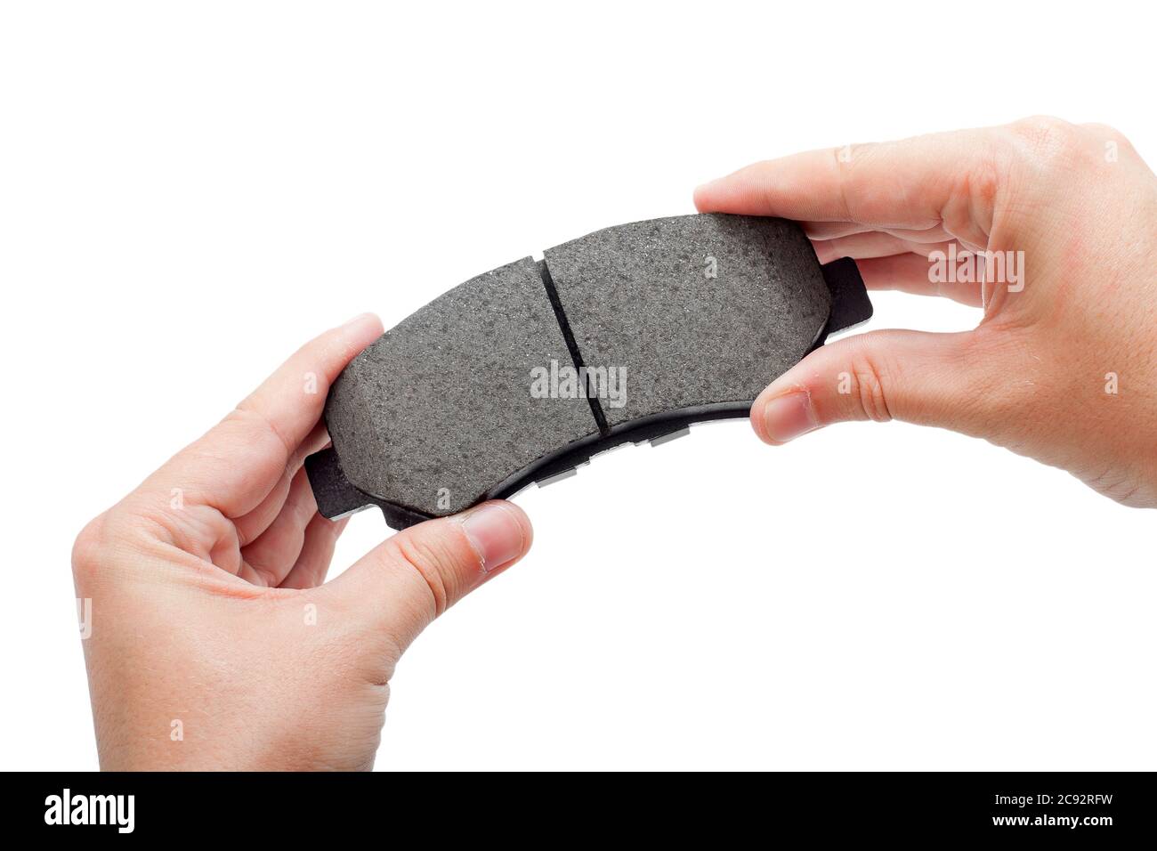 Brake pads in the engineer's hand, isolated Stock Photo - Alamy