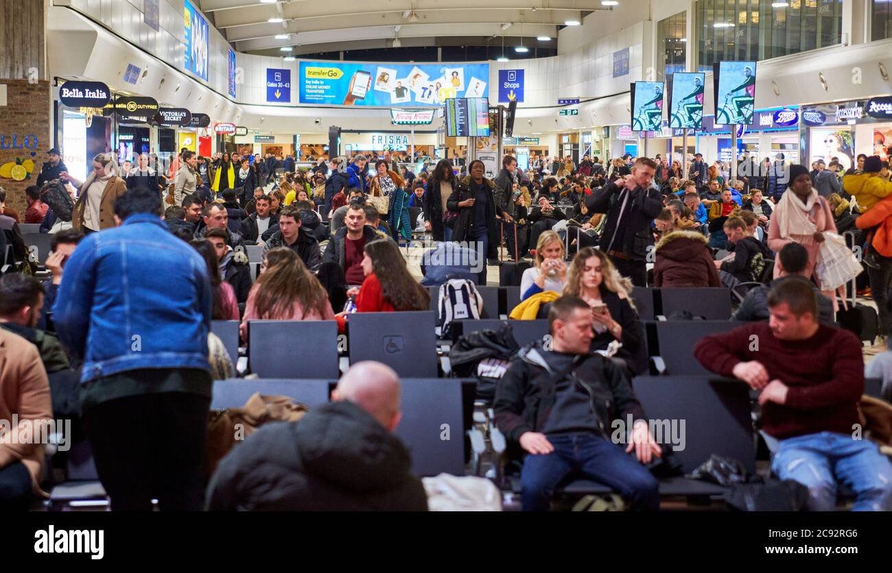 Passengers waiting in the airside terminal of Luton Airport Stock Photo ...