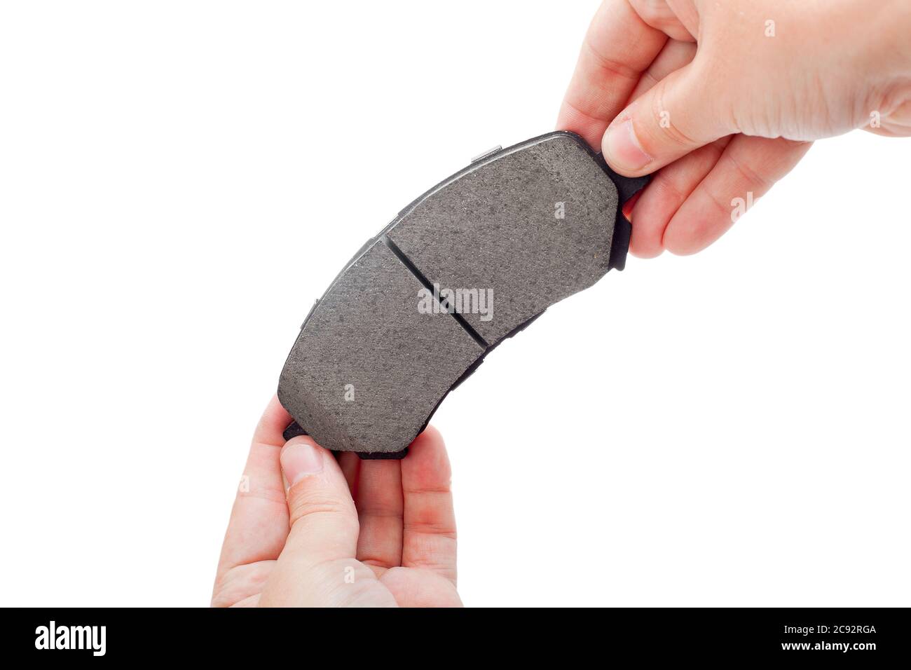 Brake pads in the engineer's hand, isolated Stock Photo - Alamy