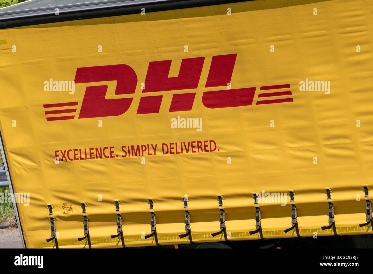 DHL international shipping; Yellow logo Haulage delivery trucks, lorry ...