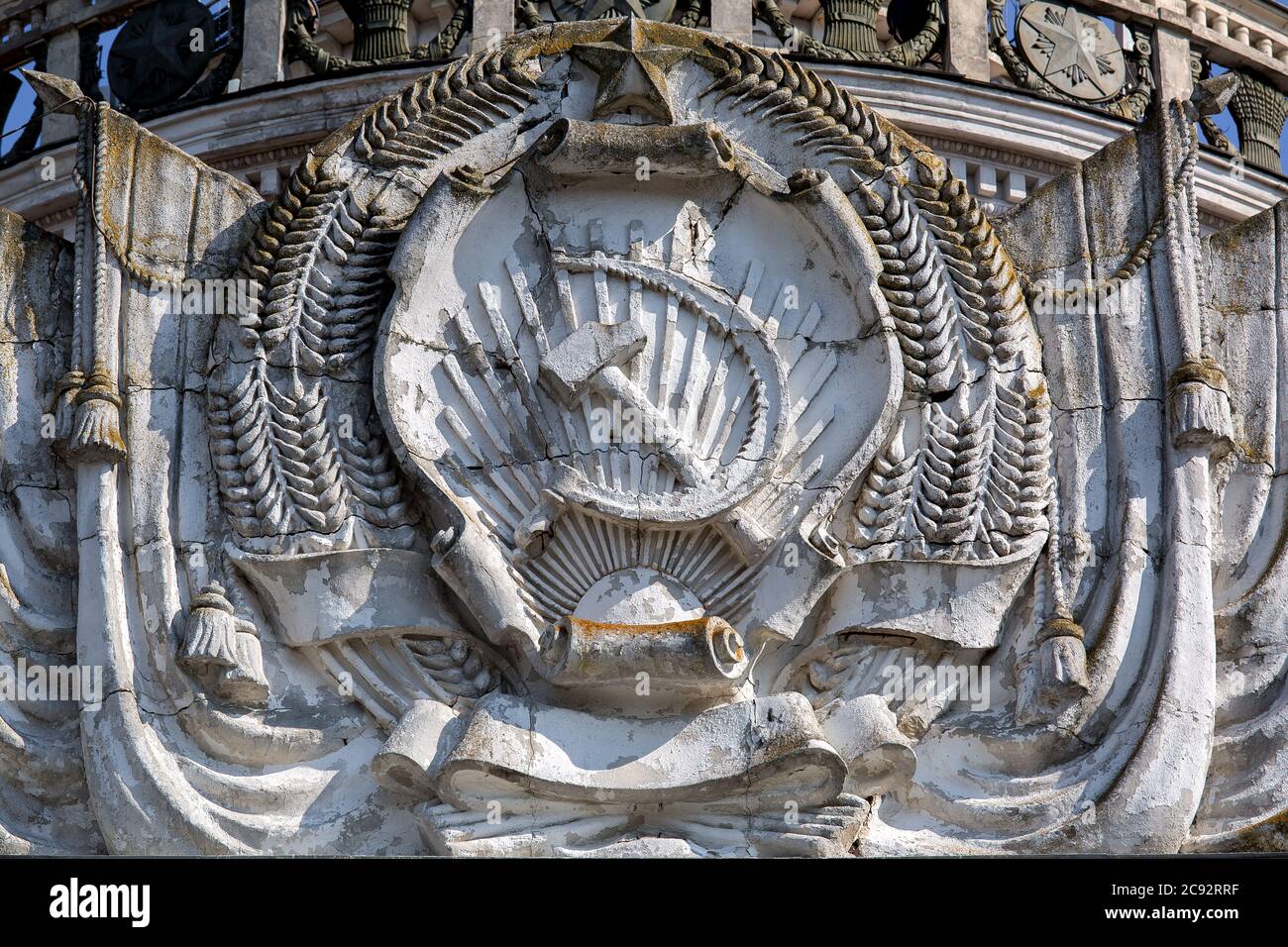 retro bas relief with a hammer and sickle of the ussr on the facade of ...