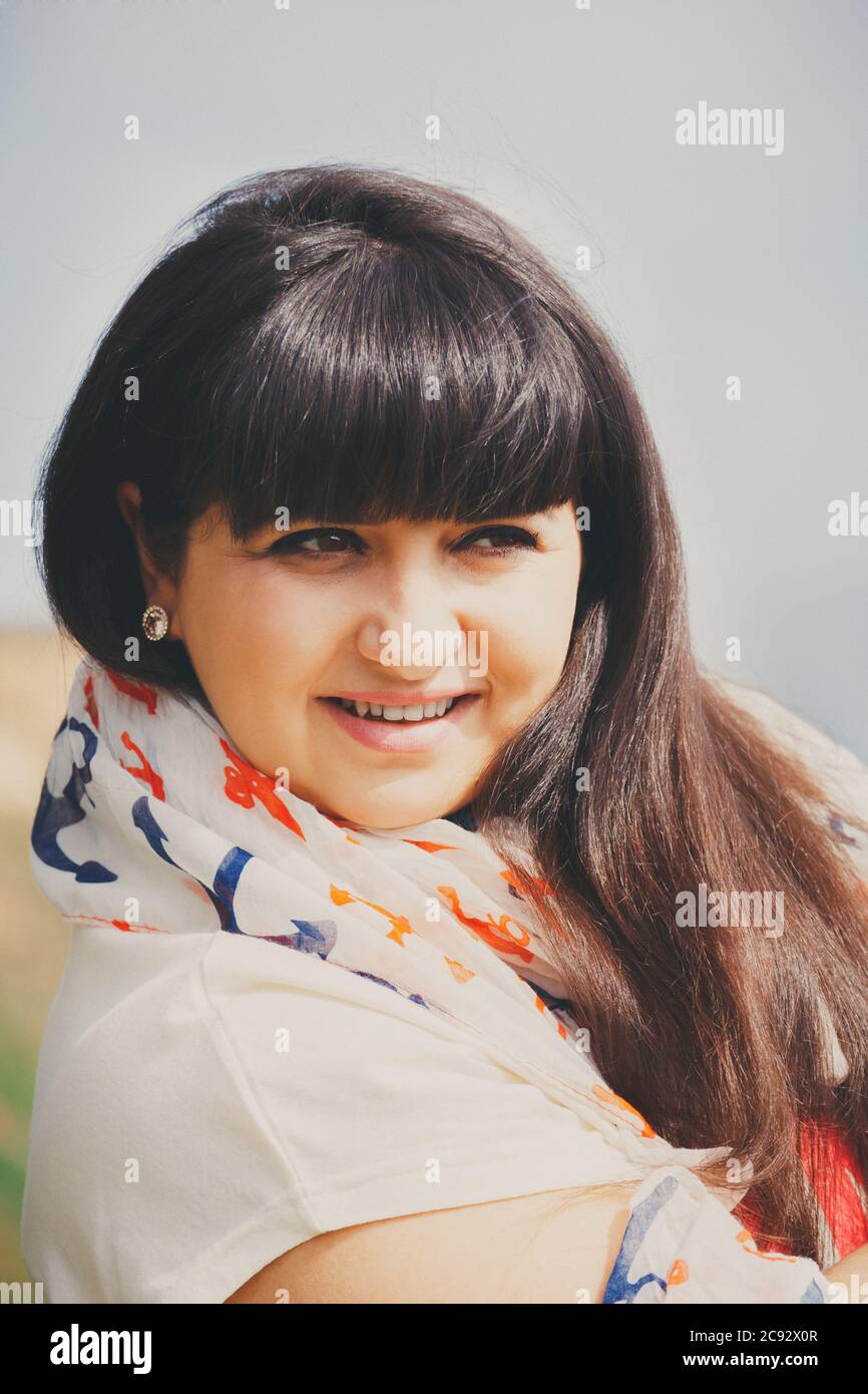 Happy smiling beautiful overweight young woman in white T-shirt and ...