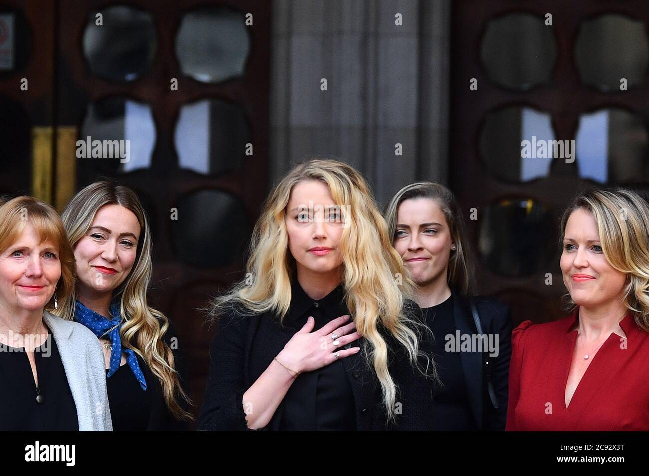 Actress Amber Heard, alongside her sister Whitney Henriquez (second ...