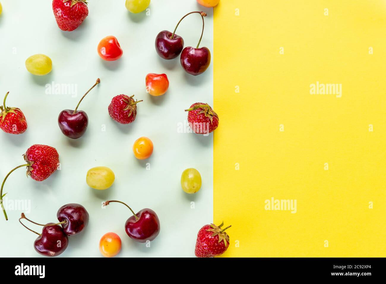 Various berries isolated on colorful background, top view. Berry border ...