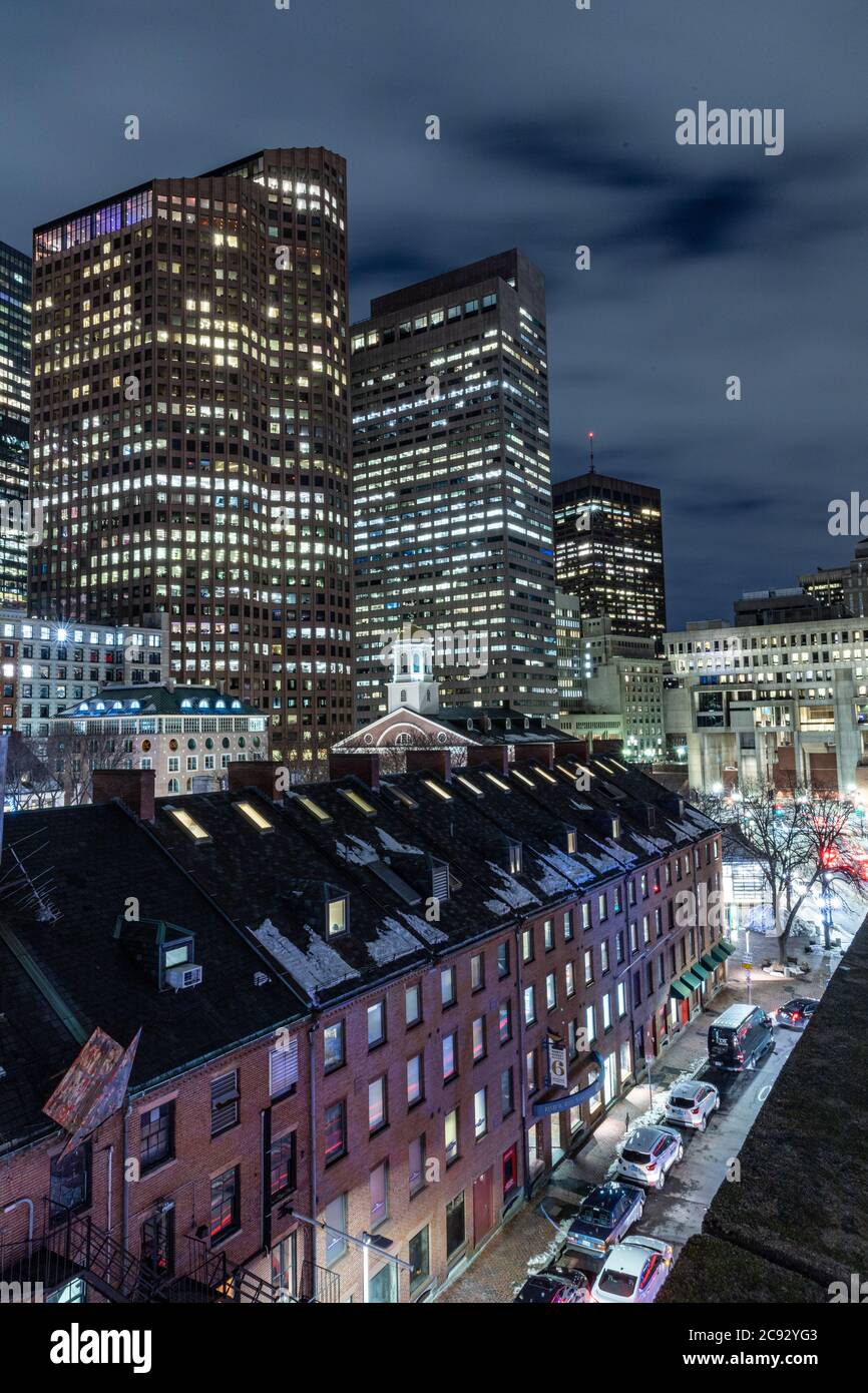 Downtown city buildings shining in the night sky Stock Photo - Alamy