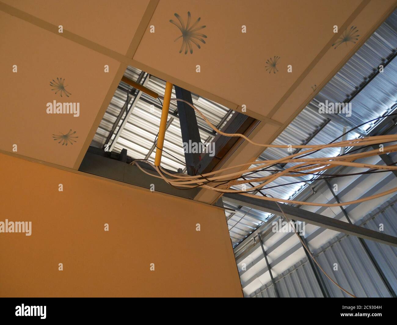electrical wire on t bar ceiling home decoration Stock Photo - Alamy