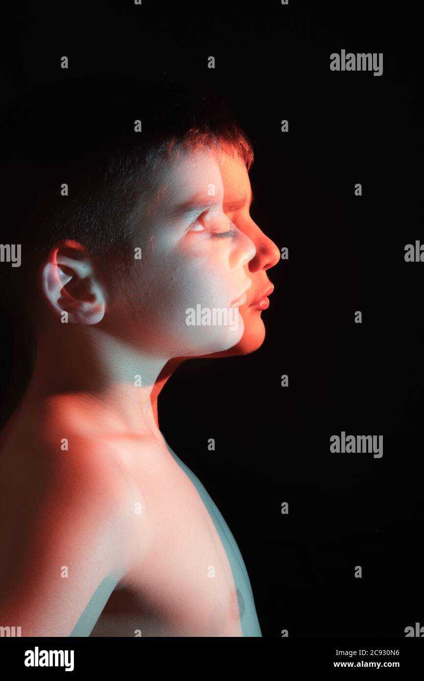 profile portrait on black background with color flash with serious sam ...